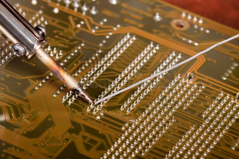 Soldering a computer board stock photo. Image of technology - 9808854