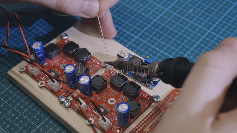 Soldering is Done on the Microchips in the Factory with a Soldering ...