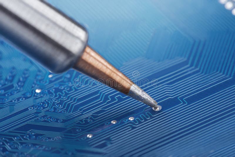 Soldering Electronic Components Onto the PCB. Electronics Repair and ...