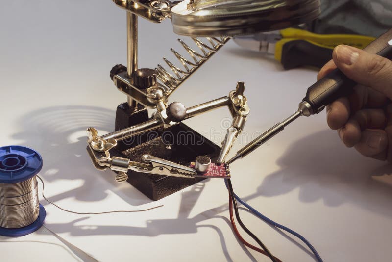 Soldering Elements of Printed Circuit Boards, Soldering Iron in Hand ...