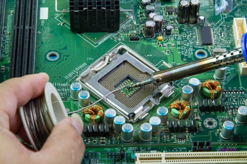 Soldering Iron and Microcircuit.Computer Motherboard Repair Stock Image ...