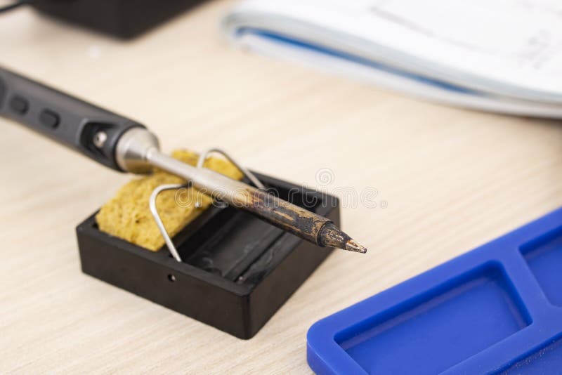 Soldering Iron on a Stand on the Desktop Stock Photo - Image of iron ...