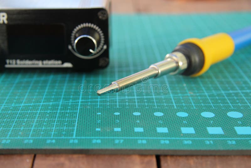 Soldering Iron on the Table on a Green Substrate Stock Photo - Image of ...