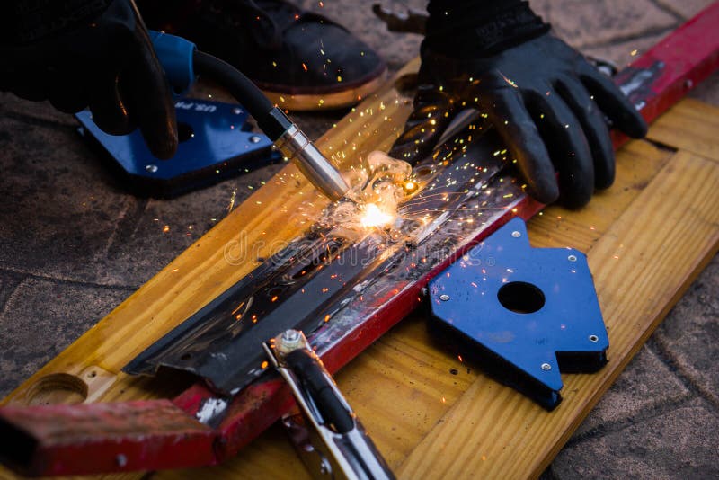 Soldering Iron with a Welding Torch between Sparks Stock Image - Image ...