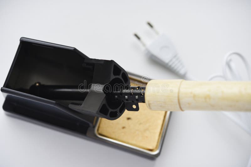 Soldering Iron with a Wooden Handle in the Holder. a Soldering Iron ...