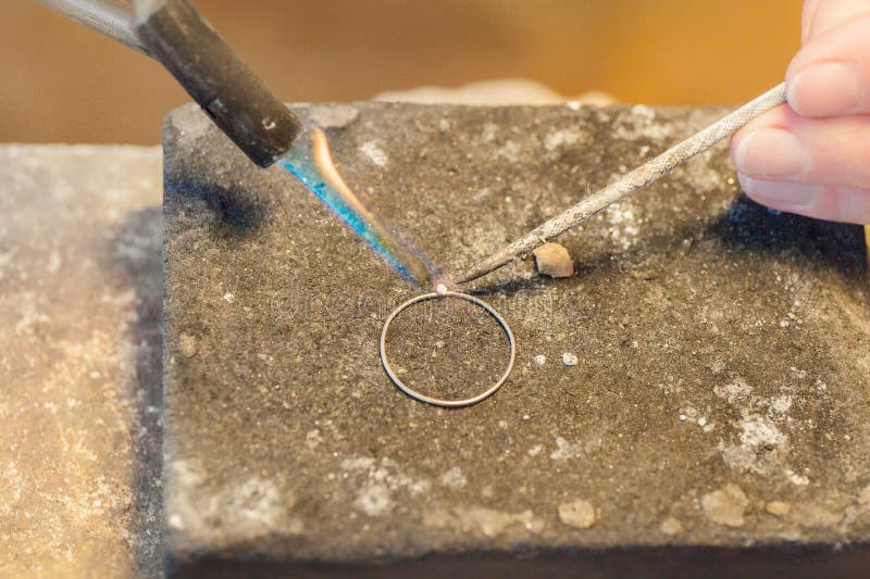 Soldering a silver ring stock image. Image of business - 32828607