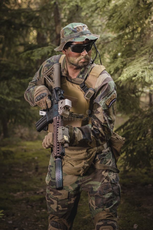 Soldier with an Assault Rifle in the Forest Stock Photo - Image of ...