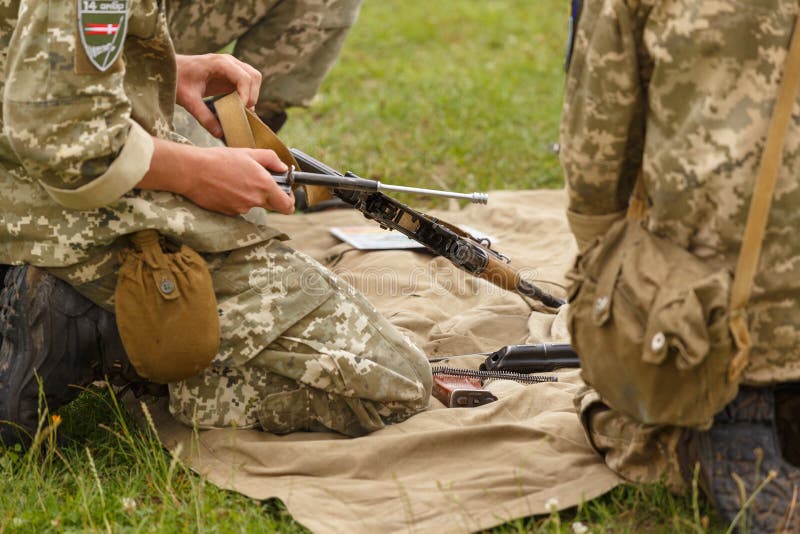 A Soldier Assembles an Assault Rifle Kalashnikov Editorial Stock Image ...