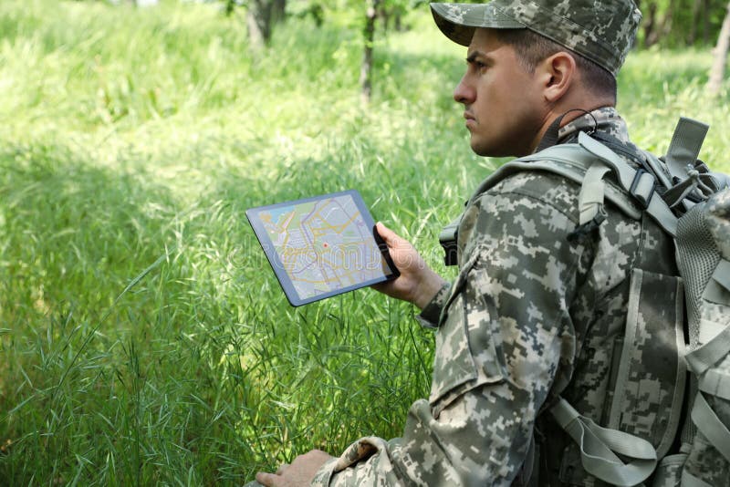 Soldier with Backpack Using Tablet Stock Image - Image of equipment ...