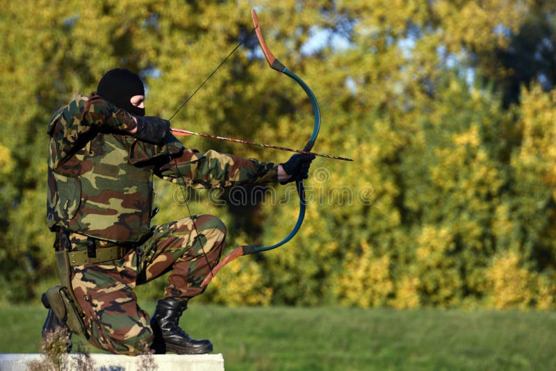 Soldier with bow and arrow stock image. Image of forest - 53423859