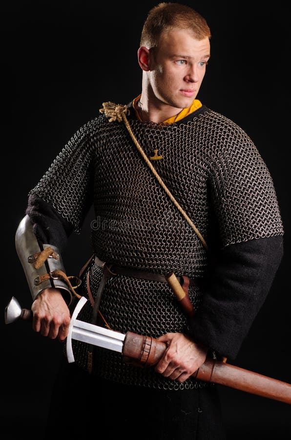 A Soldier in a Chain of Letters is Sitting Holding a Sword in Hi Stock ...