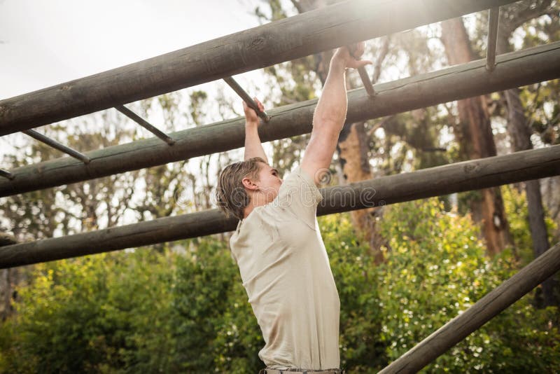 Soldier Climbing Monkey Bars Stock Photo - Image of activity, healthy ...