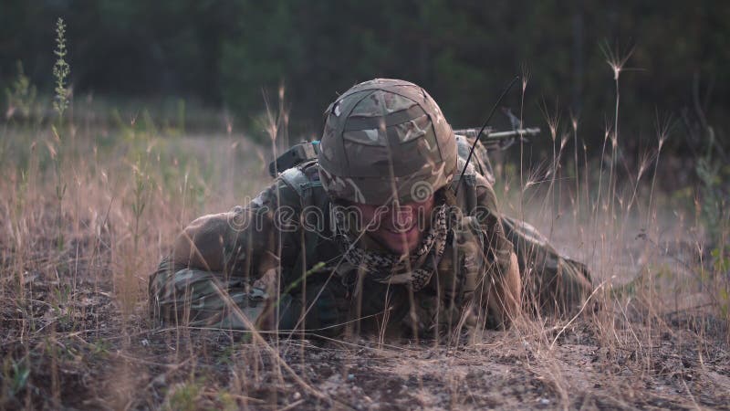 Soldier crawling in field stock image. Image of mission - 95798007