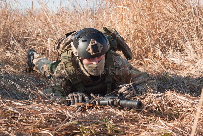 Soldier crawling in fields stock photo. Image of soldier - 82699688