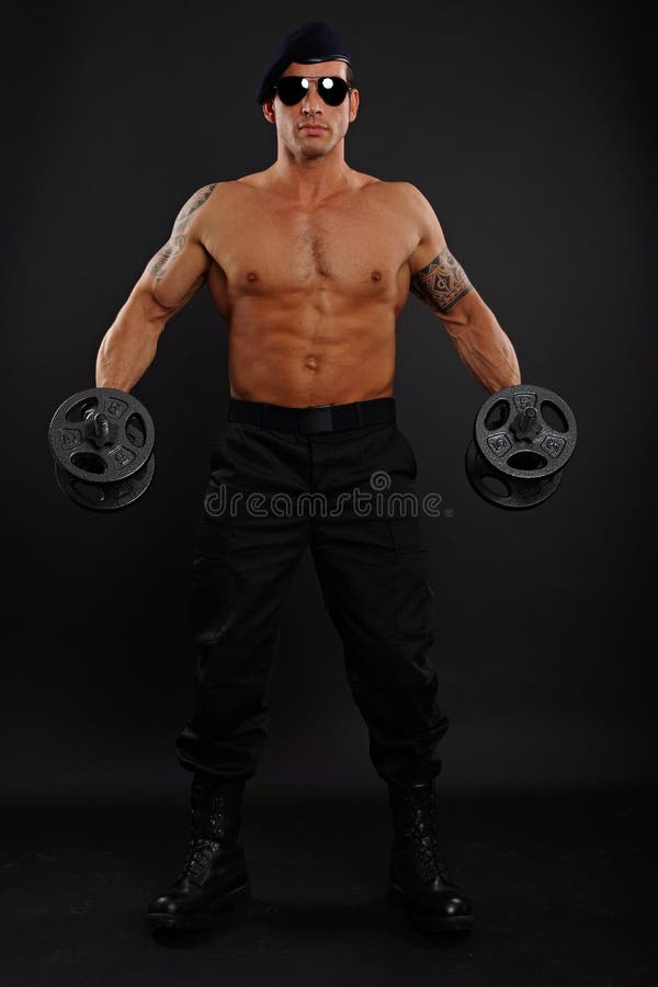 Soldier with dumbbells stock photo. Image of muscles - 39540272