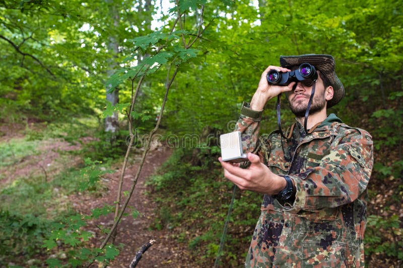 Soldier Exploring Forest Using Binoculars and Compass for Navigation ...