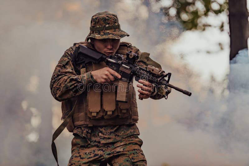 A Soldier Fights in a Warforest Area Surrounded by Fire Stock Photo ...