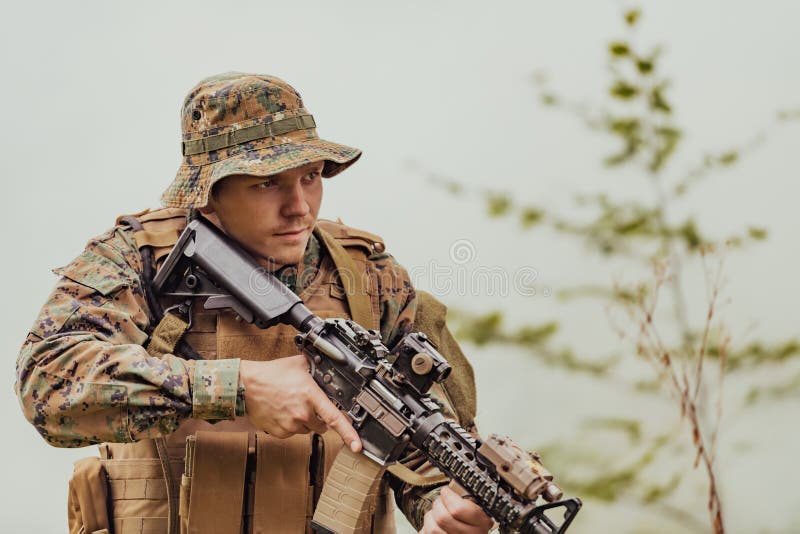 A Soldier Fights in a Warforest Area Surrounded by Fire Stock Photo ...