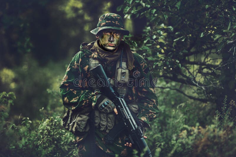Soldier in Forest Area at Twilight Stock Photo - Image of hidden, male ...