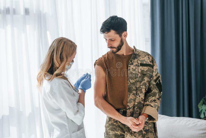 Soldier Get Vaccinated by Female Doctor Indoors Stock Image - Image of ...