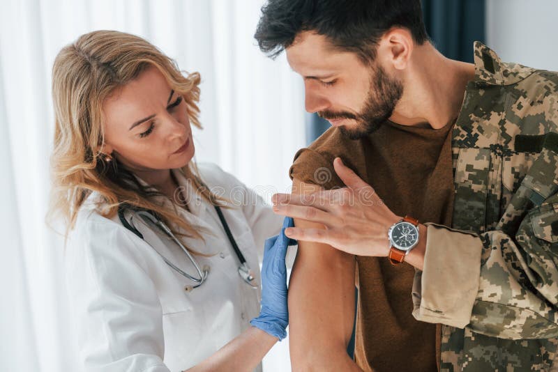 Soldier Get Vaccinated by Female Doctor Indoors Stock Image - Image of ...