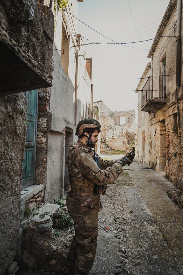 Soldier Gets Lost during War and Checks His Compass in the City Stock ...