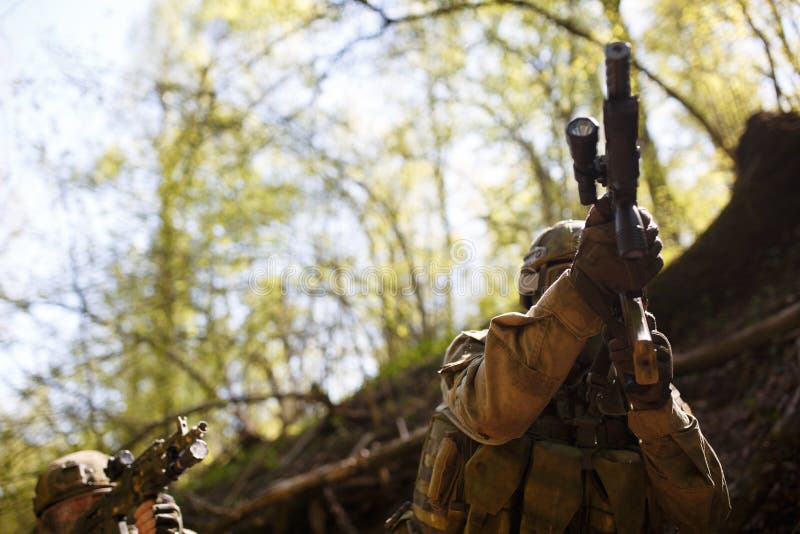 Soldier with gun in forest stock image. Image of battle - 93330629