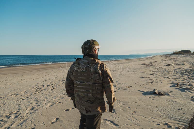 Soldier with Helmet Arriving Near the Sea Stock Image - Image of ...