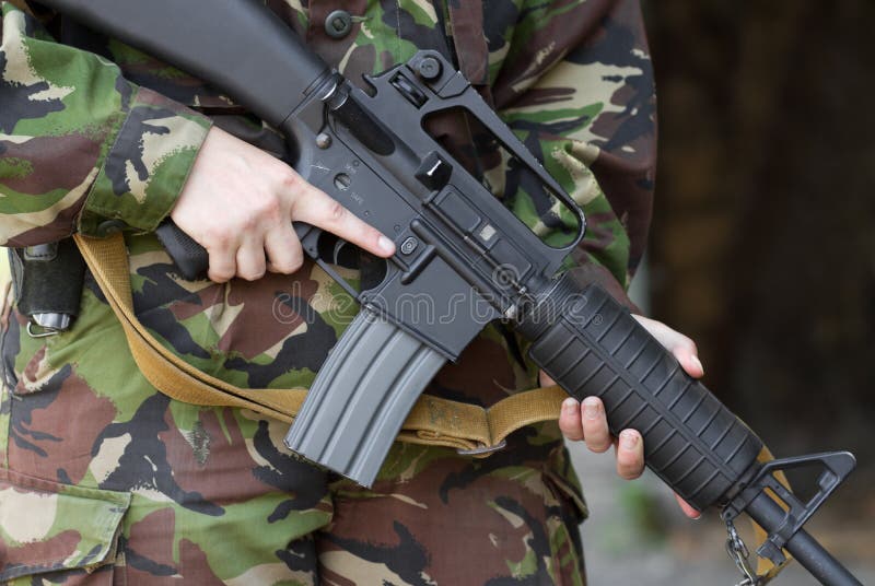 Soldier Holding Automatic Rifle Stock Photo - Image of equipment, armed ...