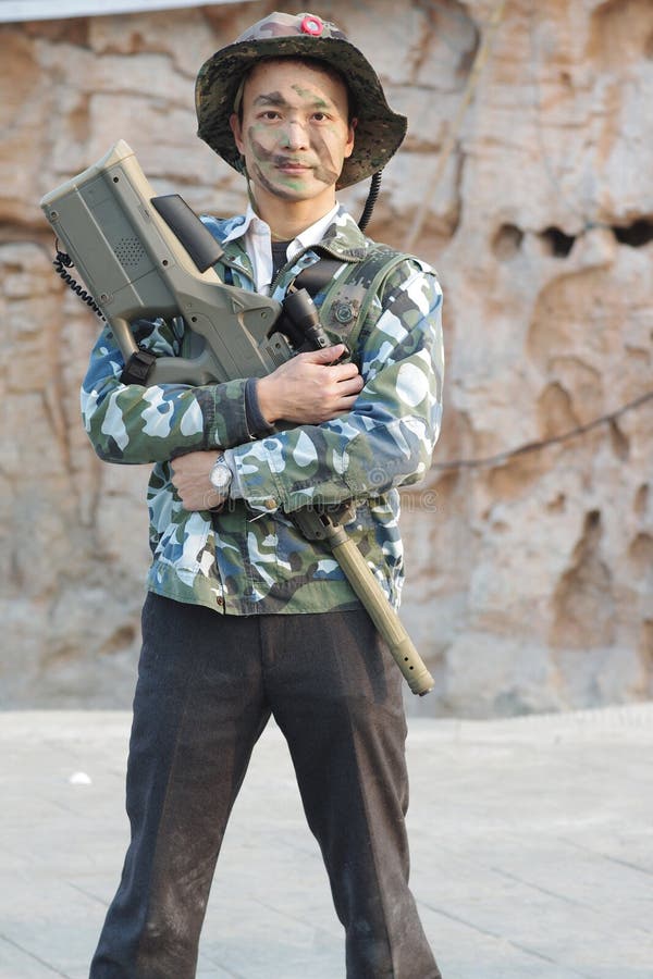 Soldier hug laser gun stock photo. Image of holding, firearm - 22580944