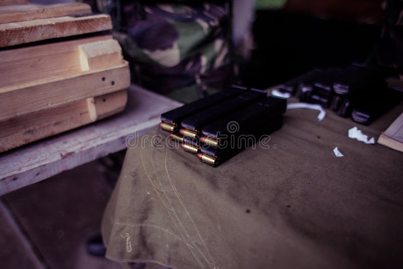 Soldier Loading a Bunch of Bullets into a Handgun Magazine. Stock Photo ...