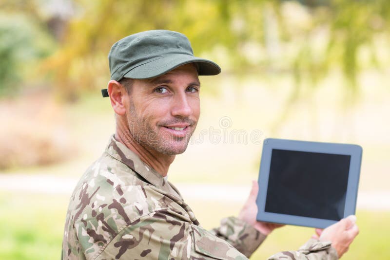 Soldier Looking at Tablet Pc in Park Stock Photo - Image of countryside ...