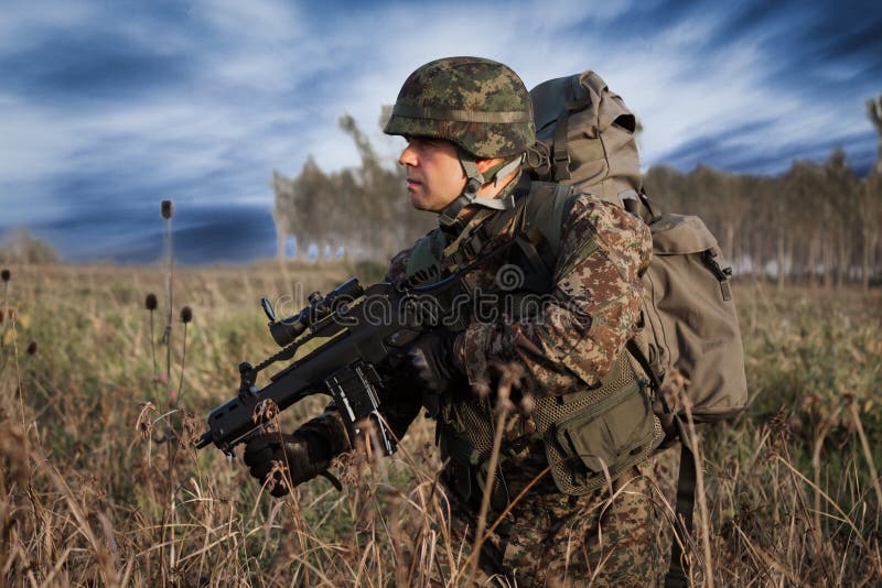 Soldier with Military Helmet and Gun in Action Stock Photo - Image of ...