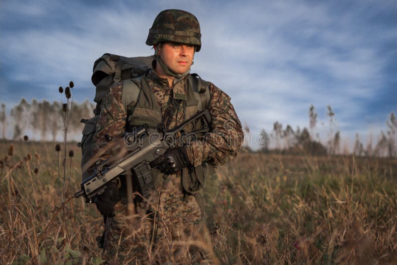 Soldier with Military Helmet and Gun in Action Stock Image - Image of ...