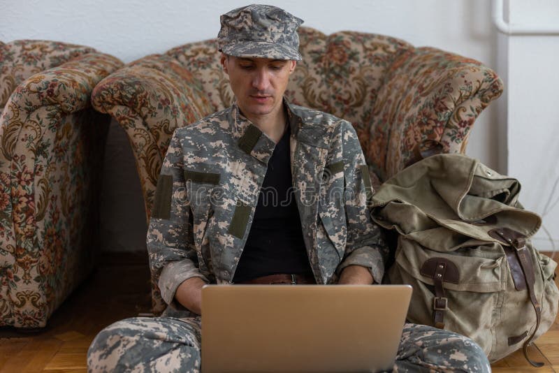 Soldier in Military Uniform Using High Tech Computer in Headquarters ...