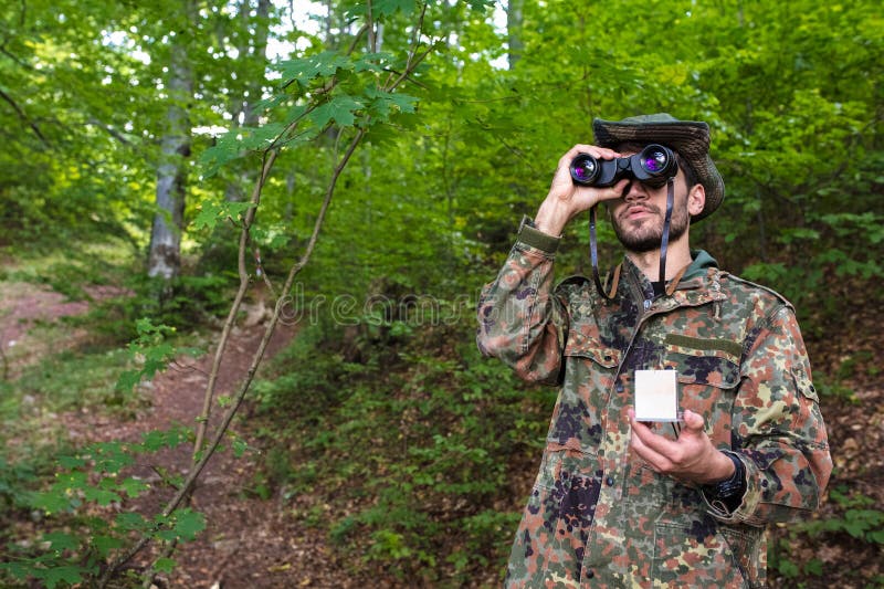 Soldier Exploring Forest Using Binoculars and Gps Device Stock Photo ...