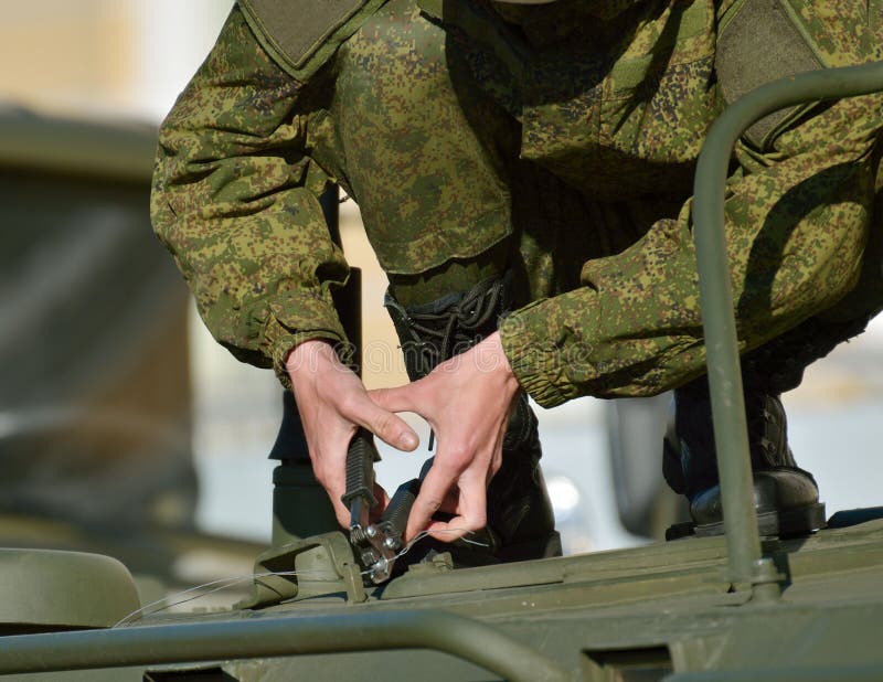 The soldier puts a seal. stock image. Image of clamp - 77508085