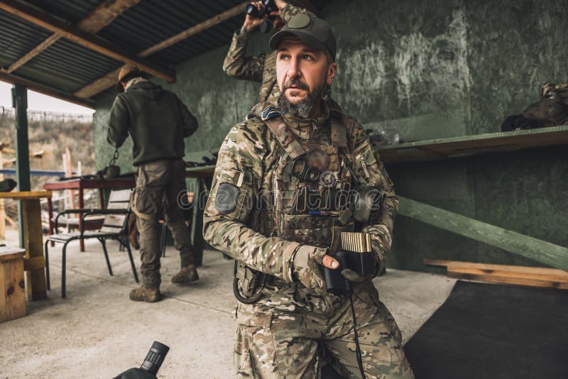 Serious Soldier in Camouflage with an Optical Rifle Stock Photo - Image ...