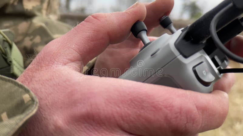 Drone Pilot Controls the Drone with a Remote Control and Sticks - the ...