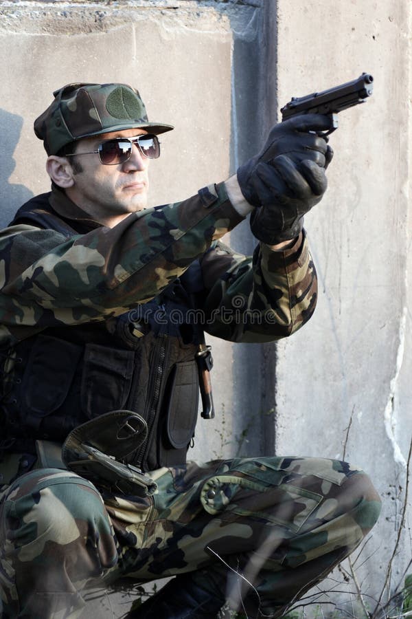 Soldier shoots with gun stock photo. Image of soldier - 61644662