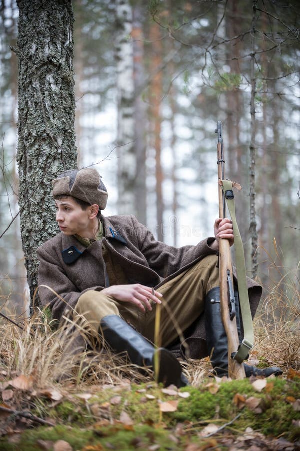A Soldier of World War II is Sitting by the Tree with a Cigarette Stock ...