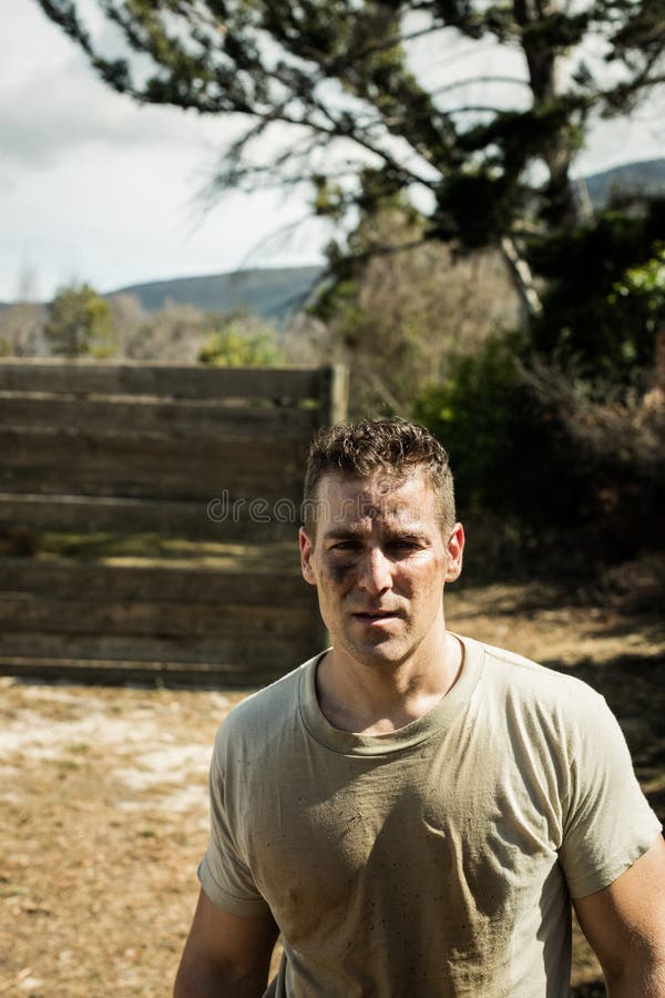 Military Man Standing with Arms Crossed during Obstacle Course in Boot ...
