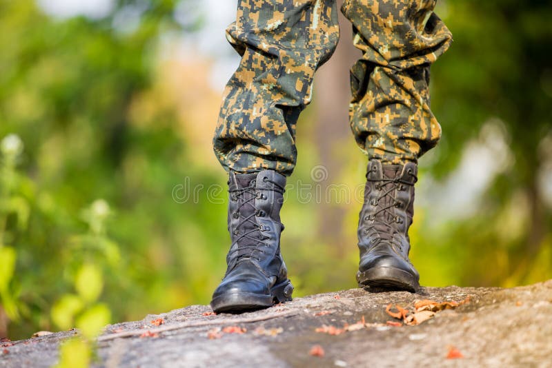 Soldier standing on stone stock image. Image of service - 82196345