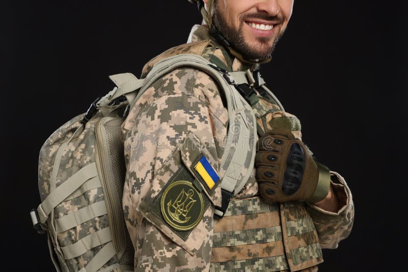 Soldier in Ukrainian Military Uniform with Backpack on Black Background ...