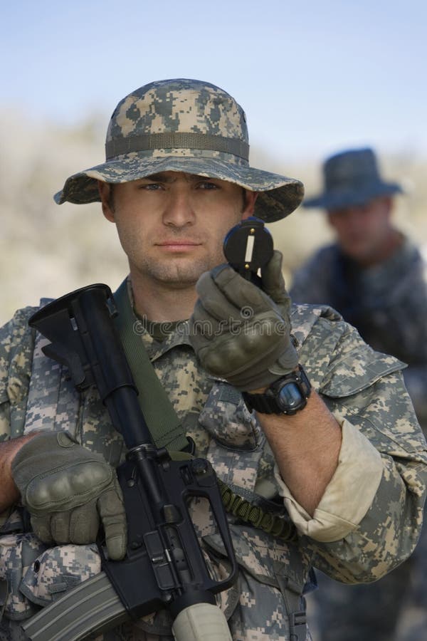 Soldier Using Compass stock photo. Image of contemplation - 29659834