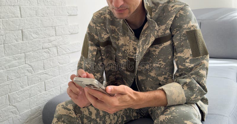 Soldier Using a Mobile Phone Against White Background Stock Photo ...