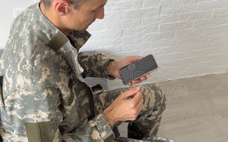 Soldier Using a Mobile Phone Against White Background Stock Photo ...