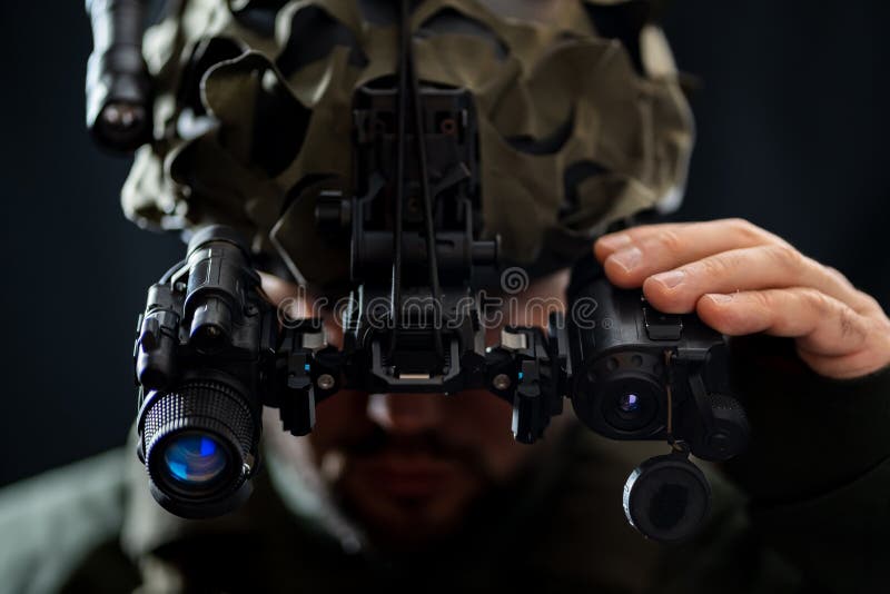 A Soldier Using Modern Binocular Night Vision in the Darkness. Close Up ...