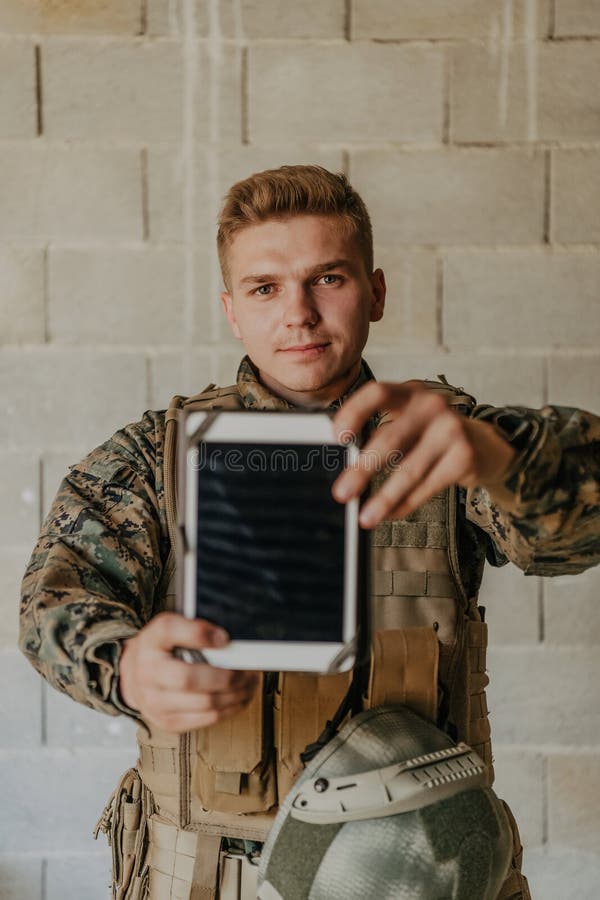 Soldier Using Tablet Computer Against Old Brick Wall Stock Photo ...