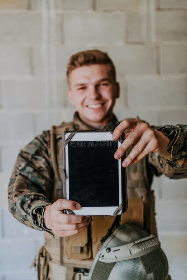 Soldier Using Tablet Computer Against Old Brick Wall Stock Photo ...